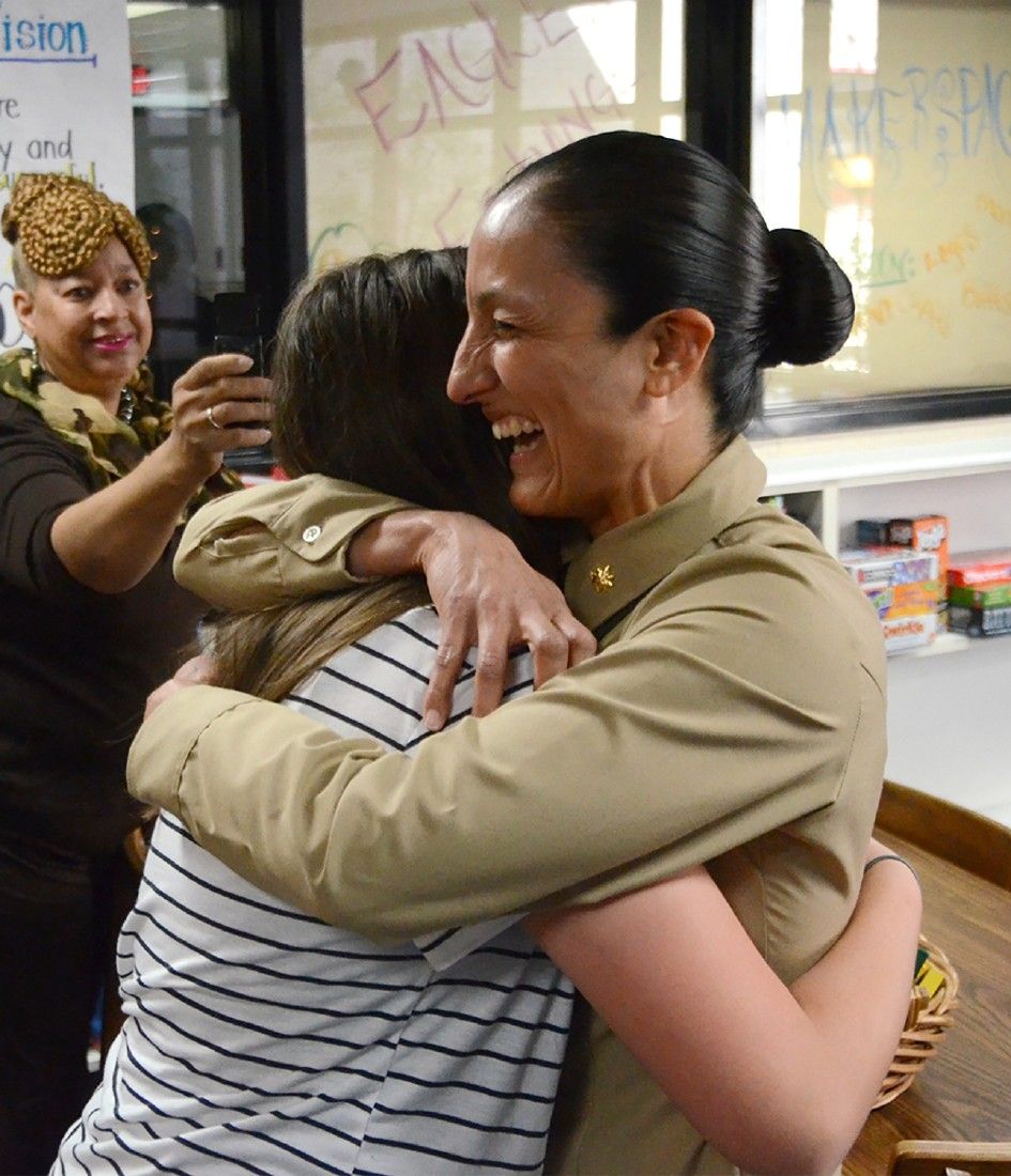 U.S. Marine surprises daughter at school after 11 months abroad