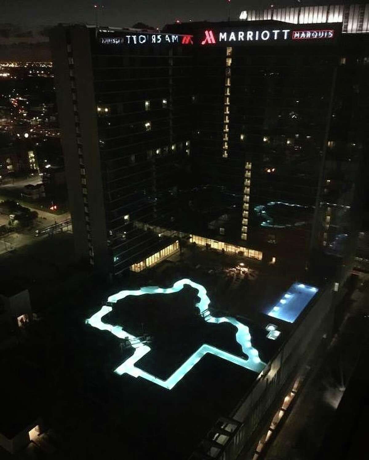 Photo: New Texas-shaped pool at Marriott Marquis is lit up at night for ...