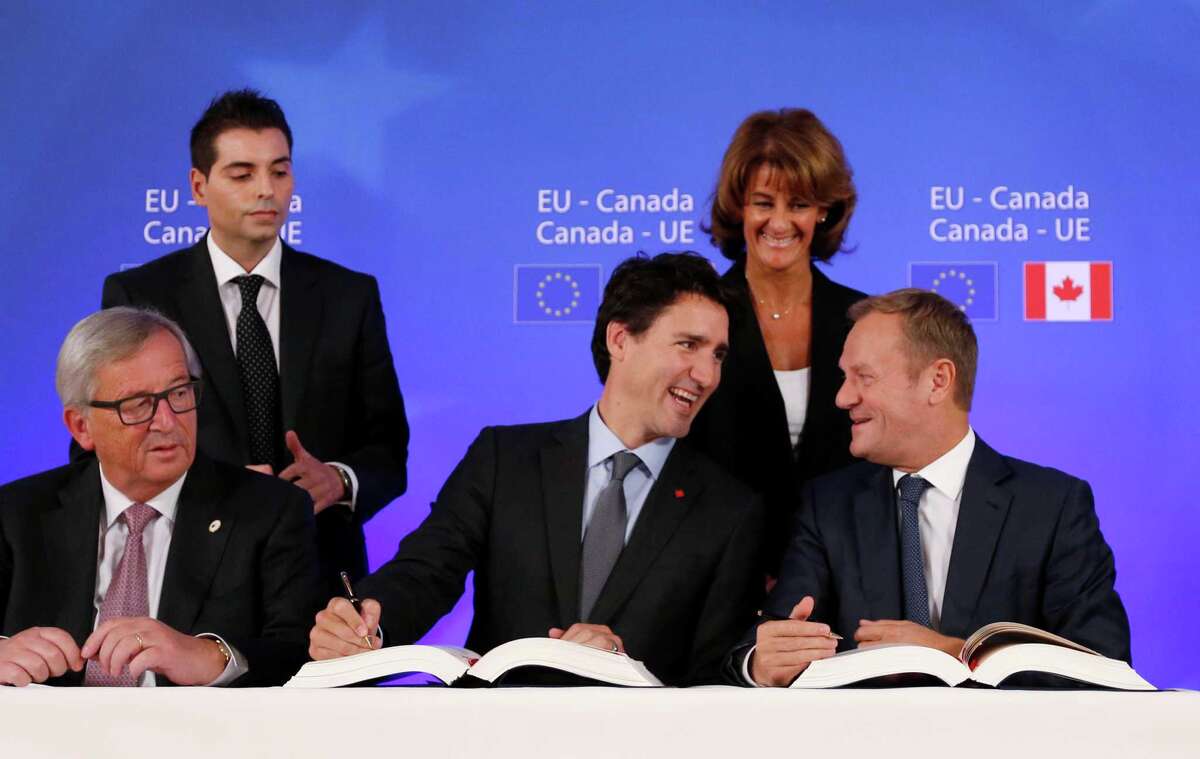 Canada, EU sign trade deal, bucking resistance to globalization