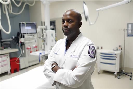 Black doctor's conflict: Saving officers, distrusting police