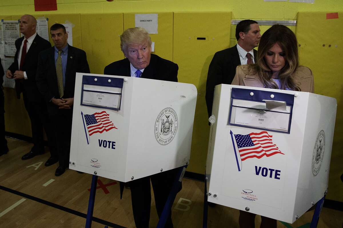 Internet mocks Trump for peering over booth at Melania while she was voting