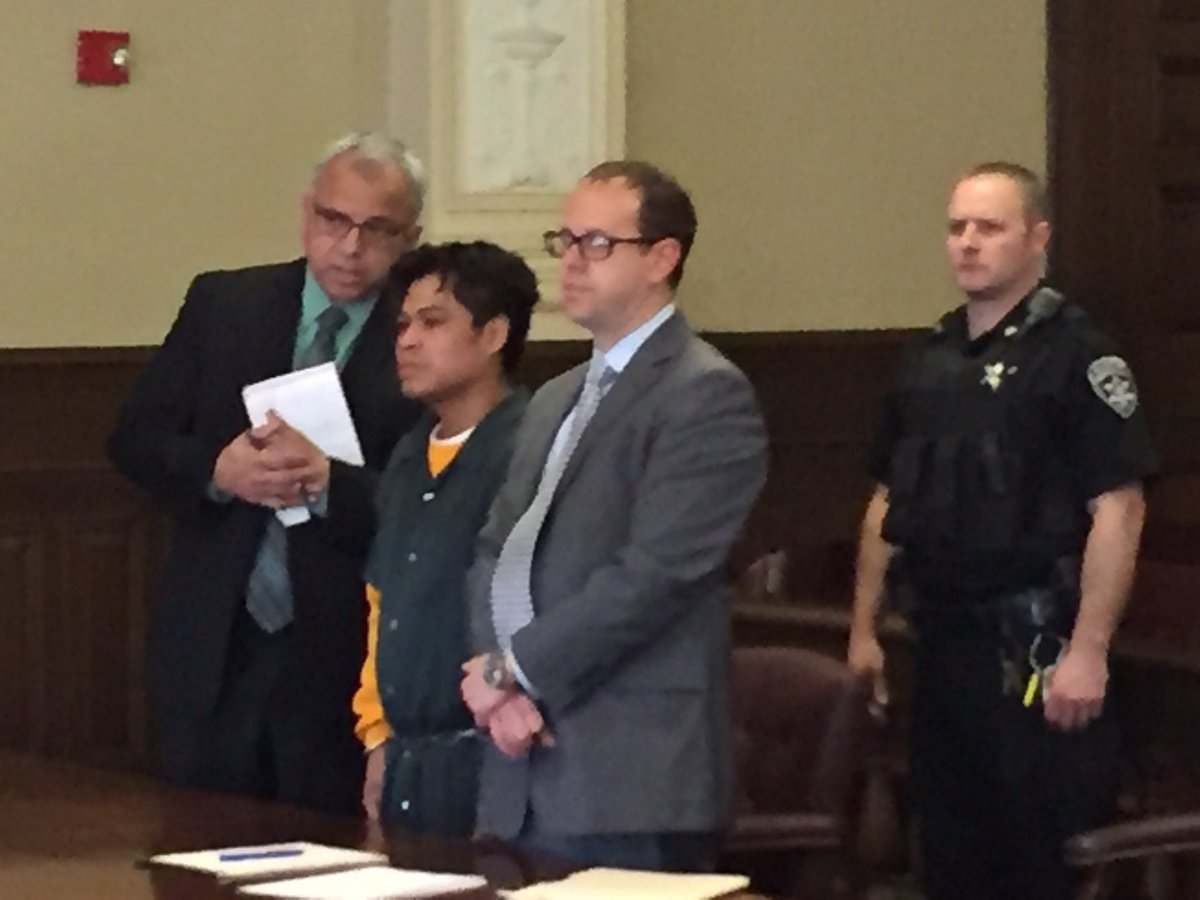 1st defendant arraigned in slaying of Troy roommates