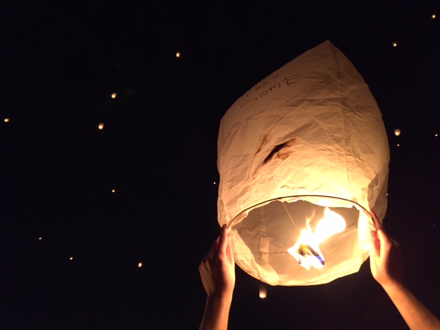 Hundreds gather to light the sky with lanterns at Baytown's Royal Purple Raceway