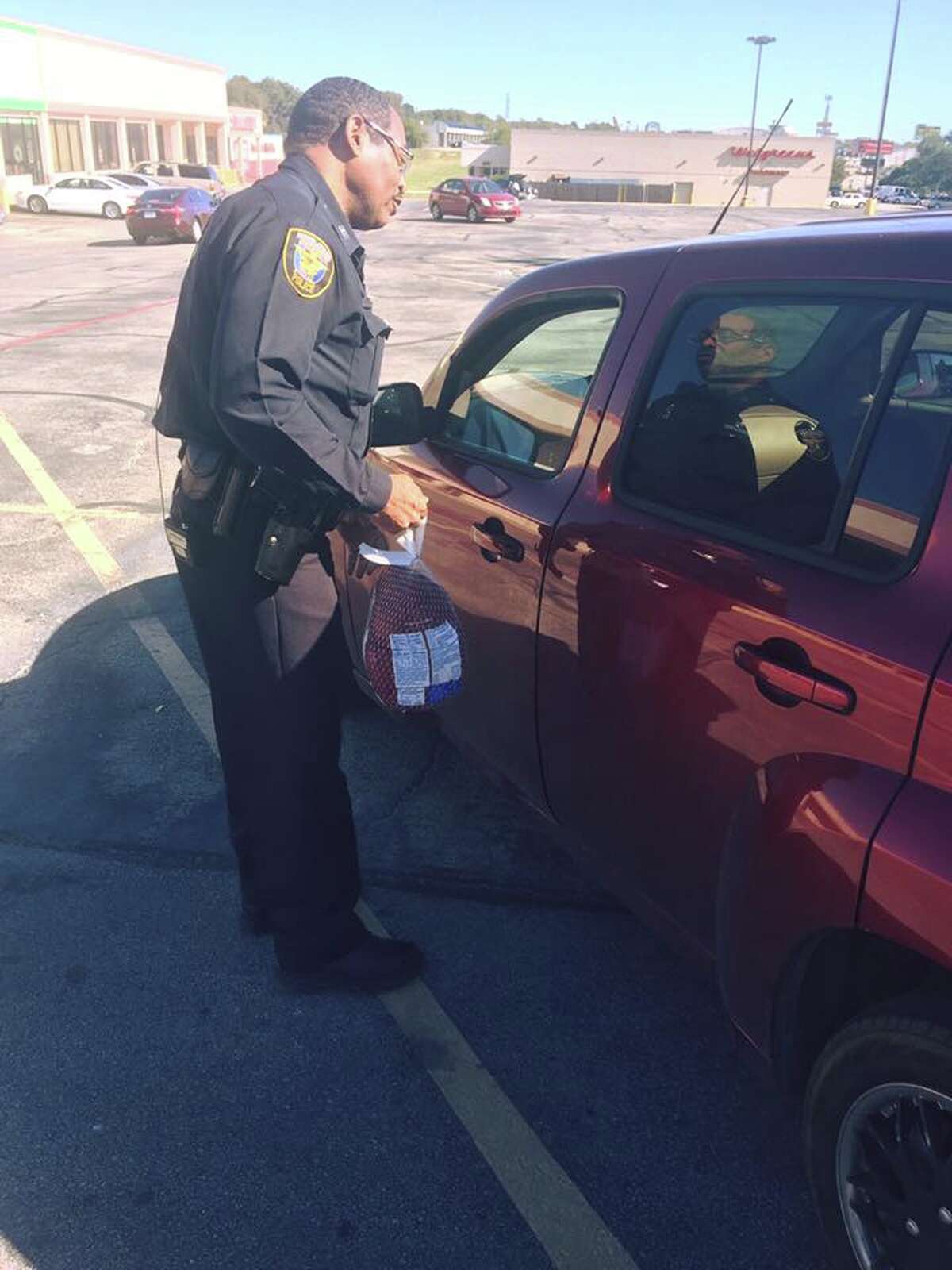 Photos: Texas police officers hand out turkeys instead of tickets ahead ...
