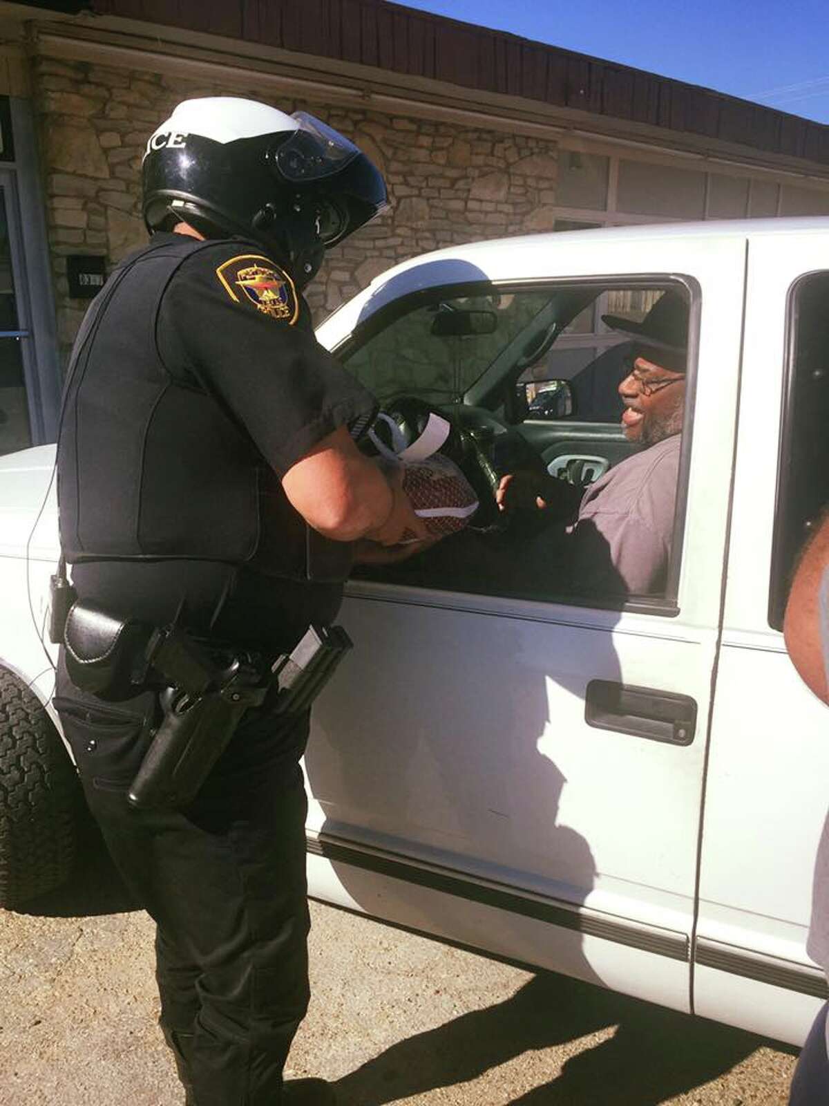 Photos: Texas police officers hand out turkeys instead of tickets ahead ...