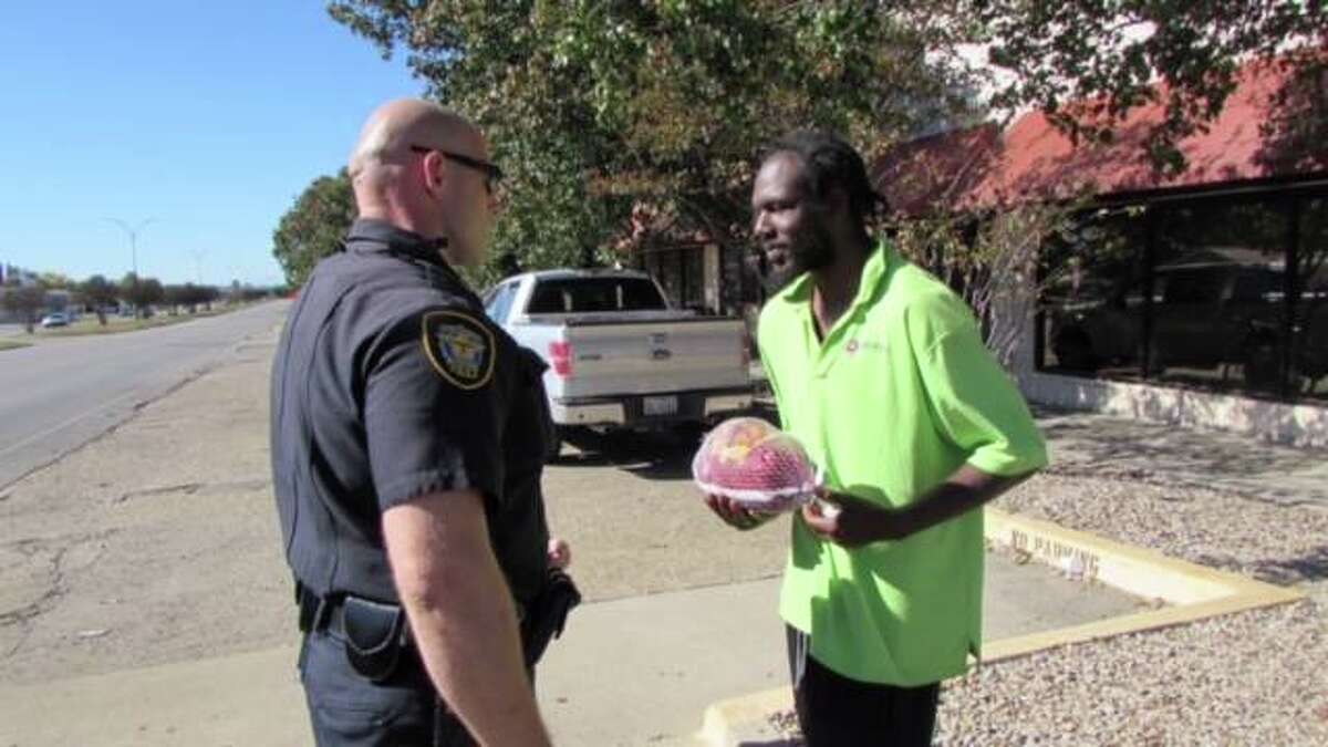 Photos: Texas police officers hand out turkeys instead of tickets ahead ...