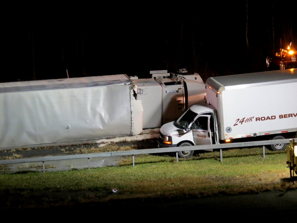 Box truck rolls on Thruway, spills cargo
