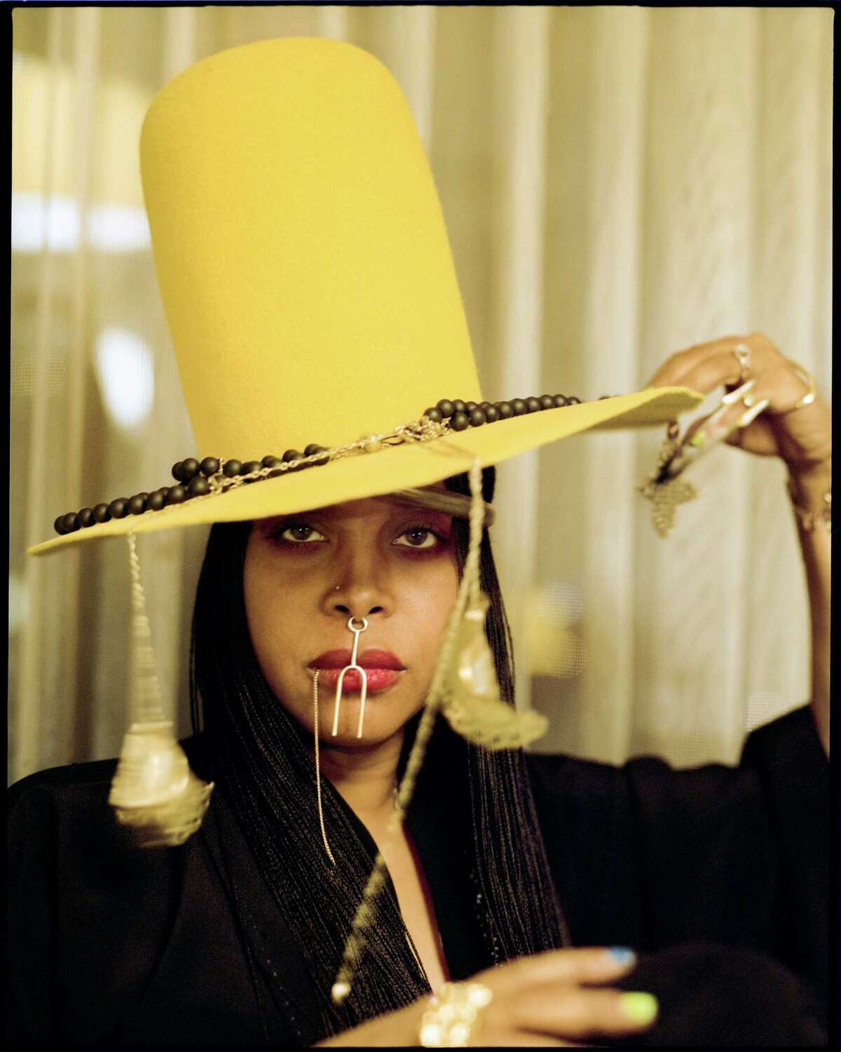 Badu's braids take time, music - and incense