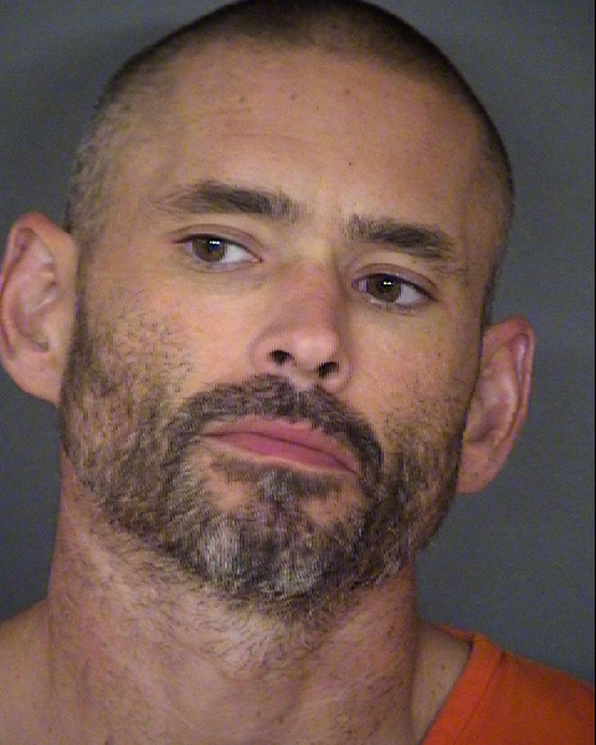 Police: 4 charged in East Side ax murder prompted by money dispute