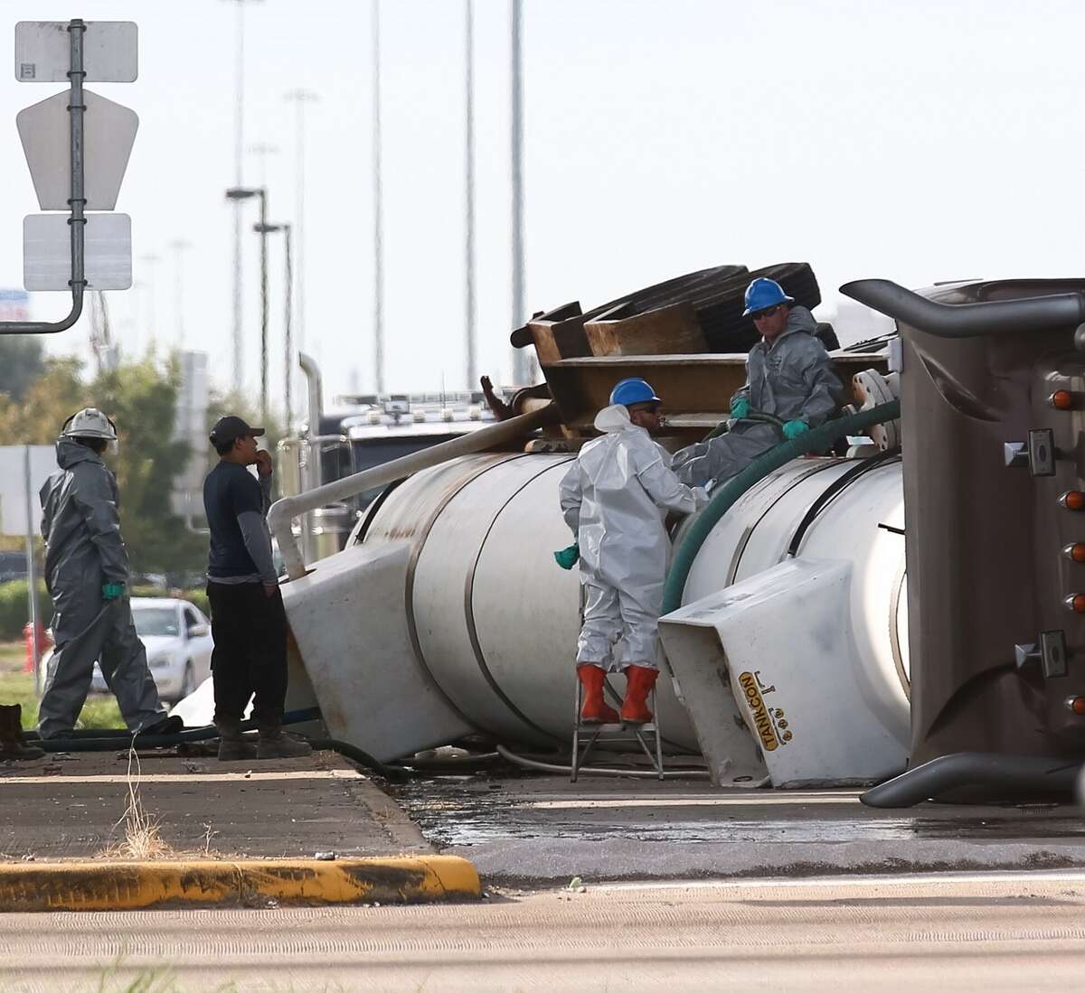 Tanker truck rolls over on Highway 225, spills hydrochloric acid
