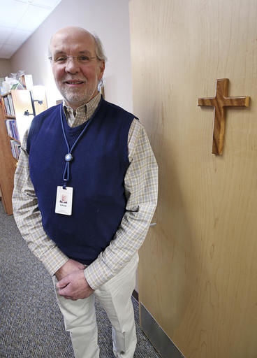 Hospice chaplain comforts the grieving and the dying