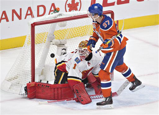 McDavid scores twice, Oilers beat Flames 7-4 in new arena