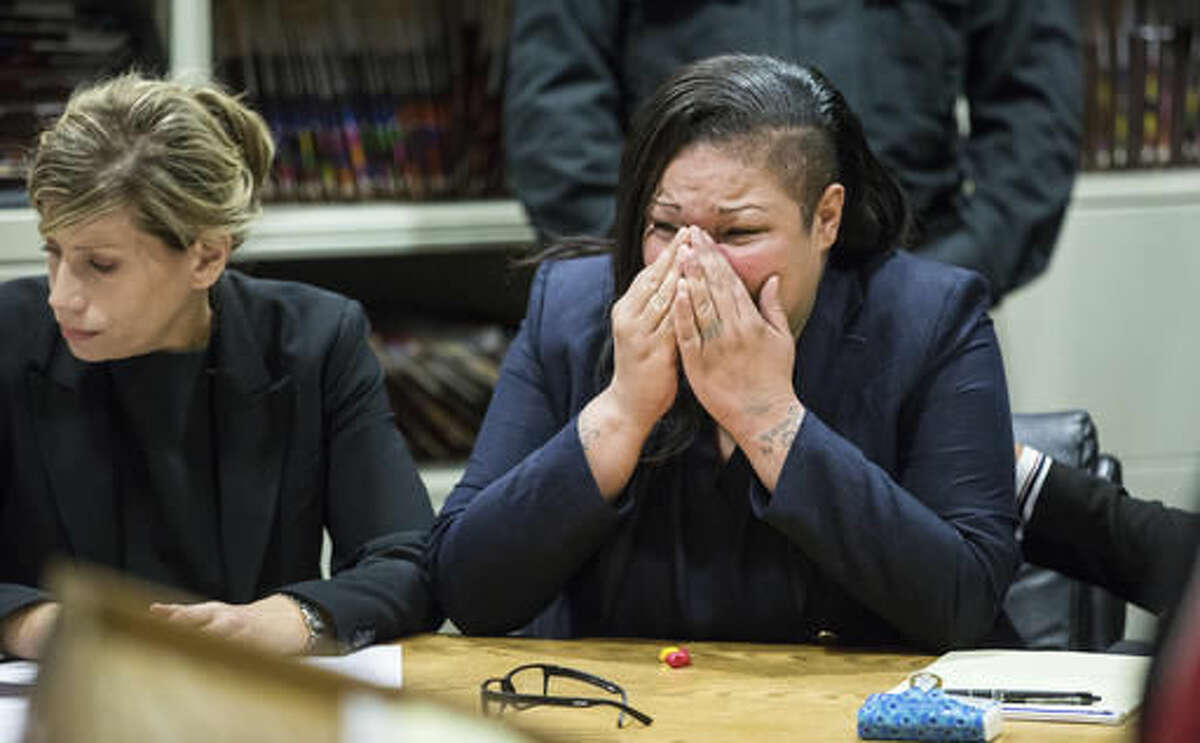 Judge resentences woman to 63 years for 1992 gang killings
