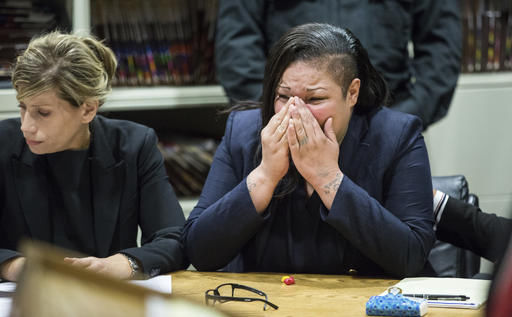 Judge resentences woman to 63 years for 1992 gang killings