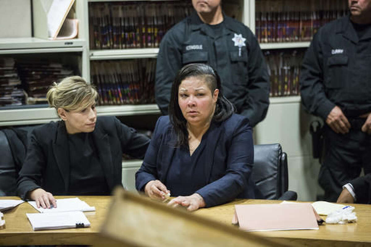 Judge resentences woman to 63 years for 1992 gang killings