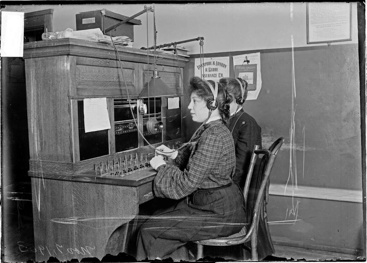 Women using telephone switchboards
