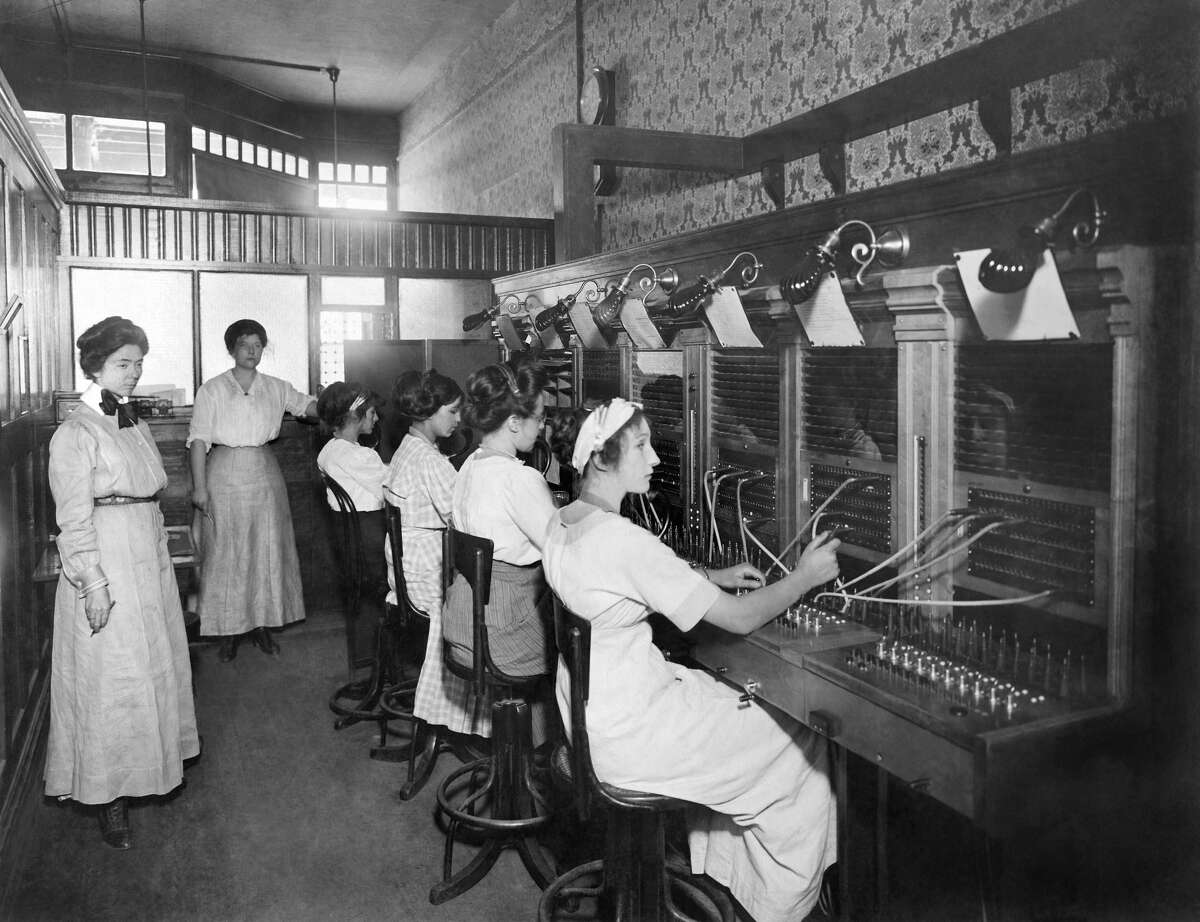 Women using telephone switchboards