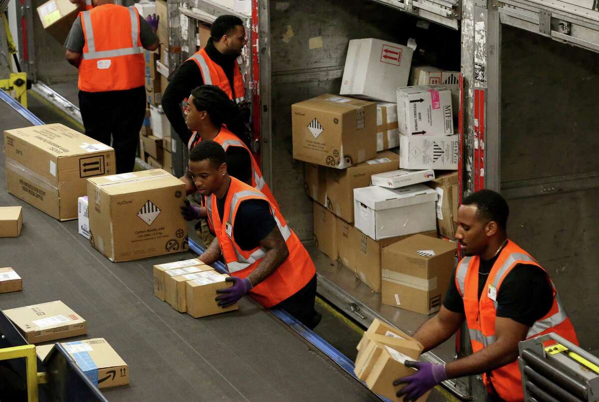 FedEx workers race to meet record demand