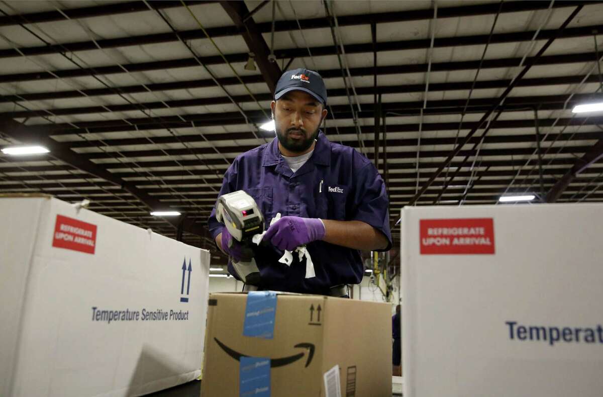 FedEx workers race to meet record demand