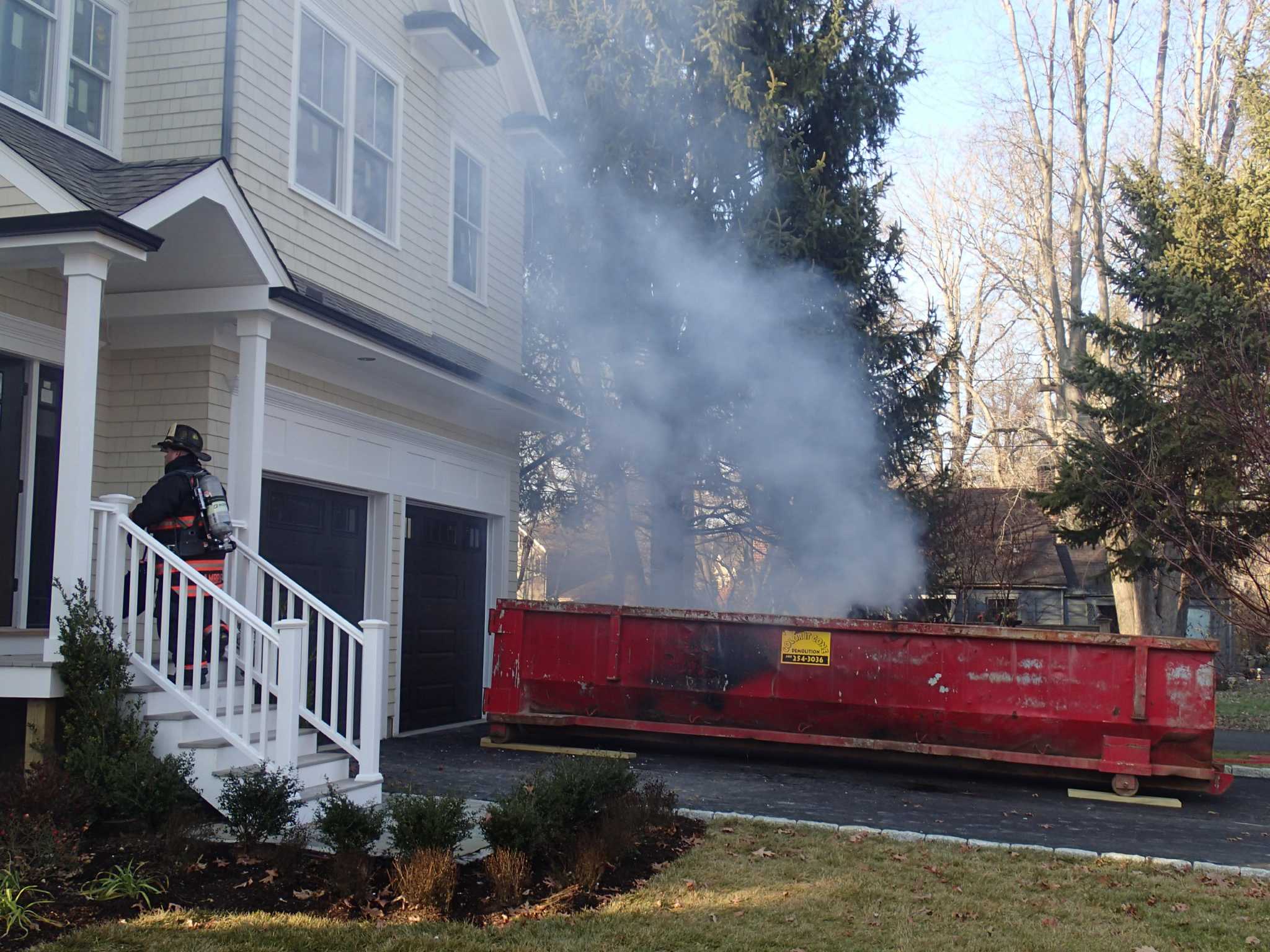 Trash fire near home quickly extinguished