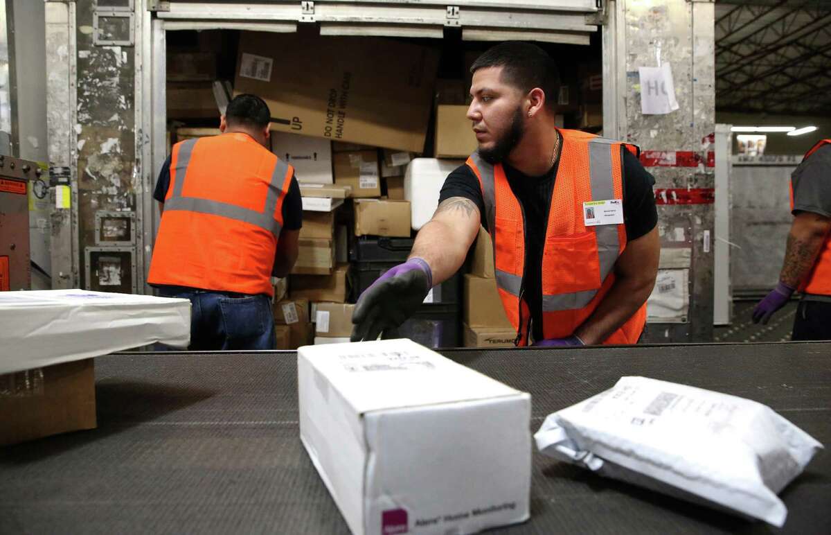 FedEx workers race to meet record demand