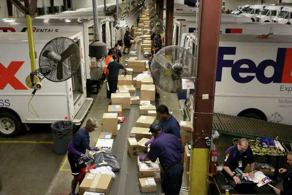 FedEx workers race to meet record demand - ExpressNews.com