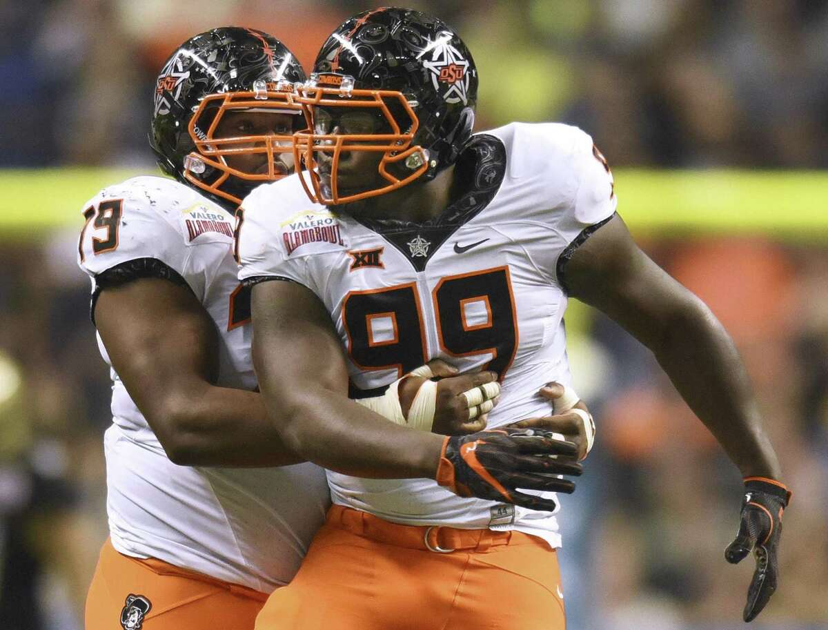 Oklahoma State duo, defense throttle Colorado