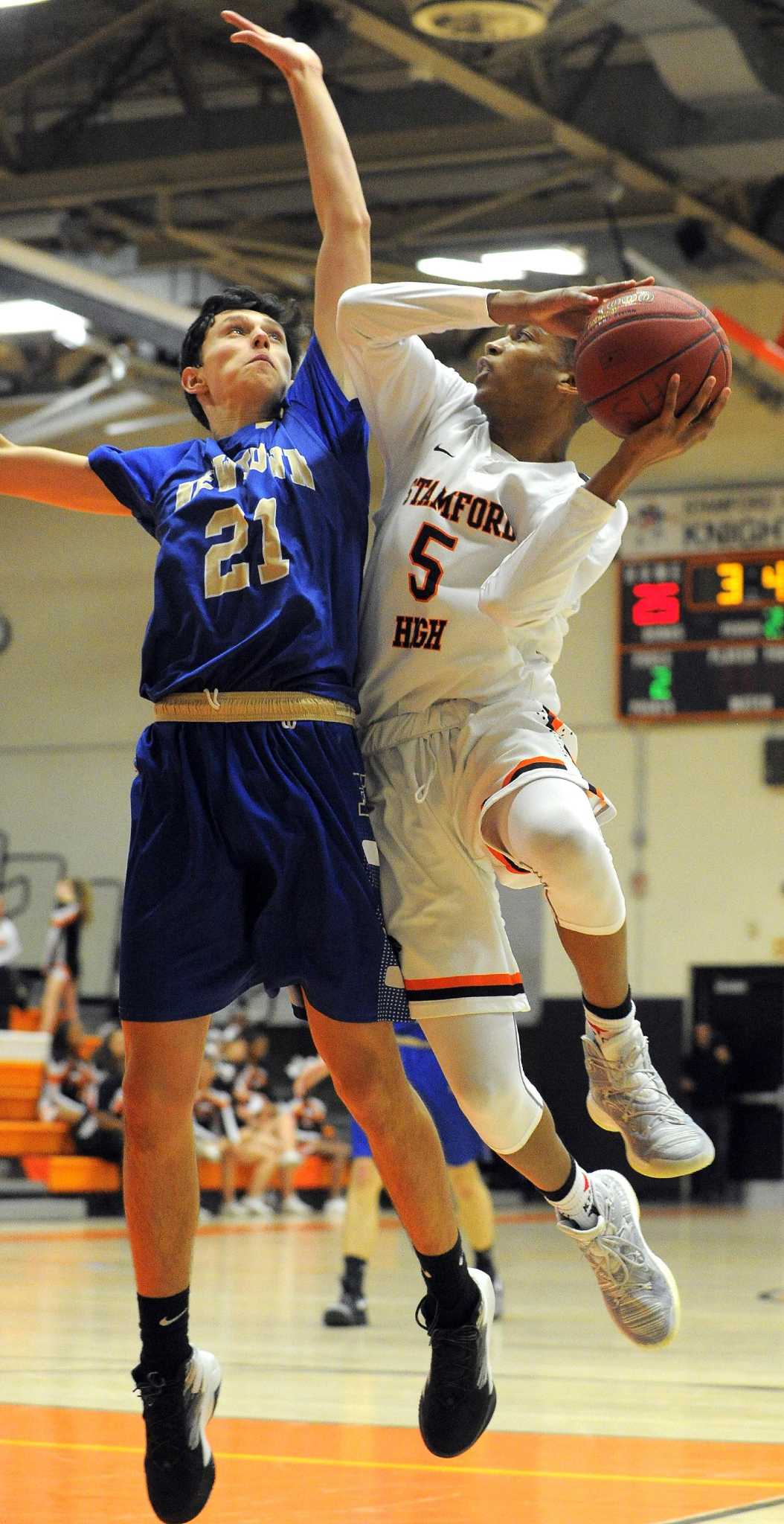 Stamford boys basketball holds off Newtown
