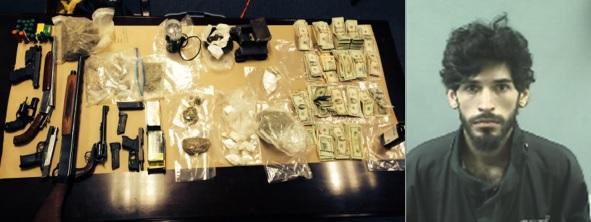 Police seize guns, drugs and money in raid