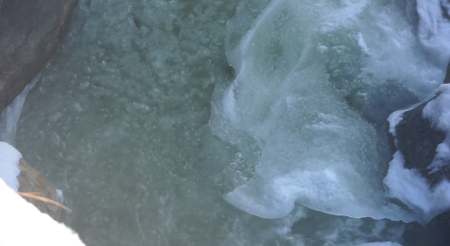 Slurpee-like frazil ice flowing down Yosemite Creek, closes trail