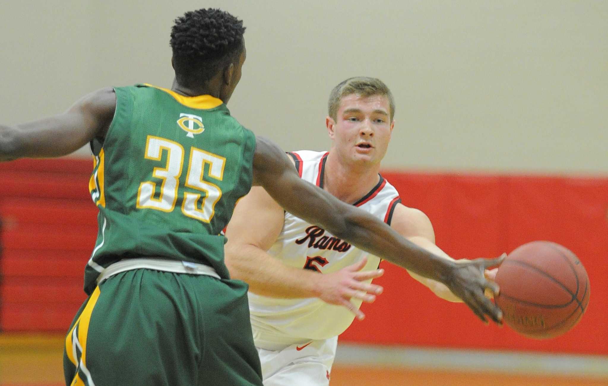 New Canaan boys basketball upsets Trinity Catholic