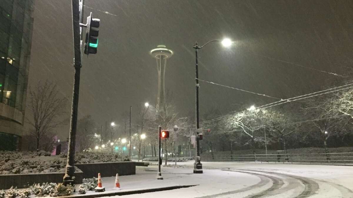 Seattle covered in snow, more falling, closures abound