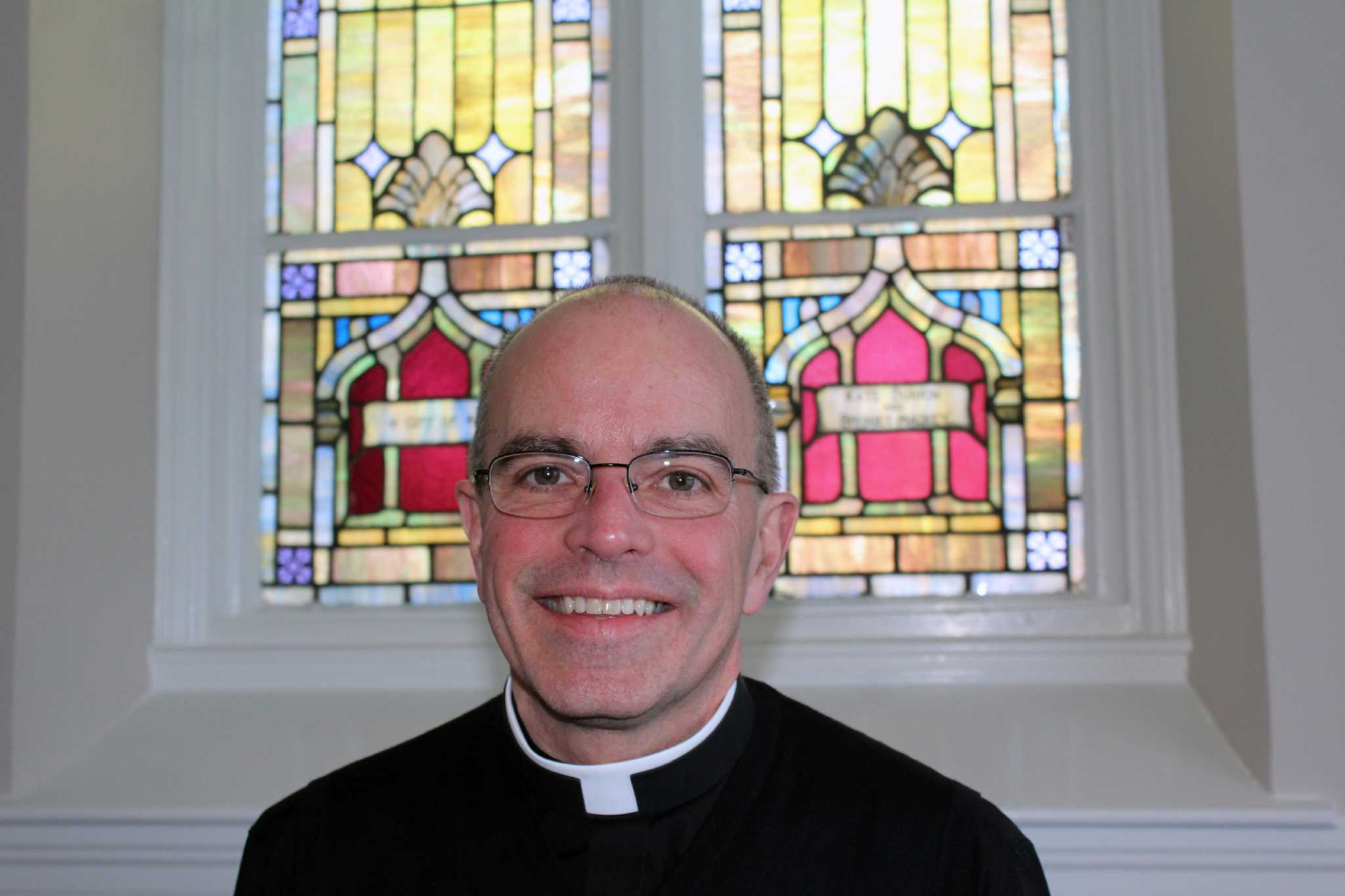Father Robert Kinnally gets settled in new role at St. Aloysius
