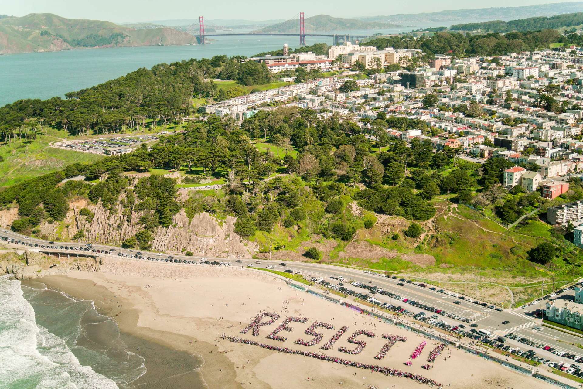 Thousands of protesters spell out 'RESIST!!' on San Francisco's Ocean Beach