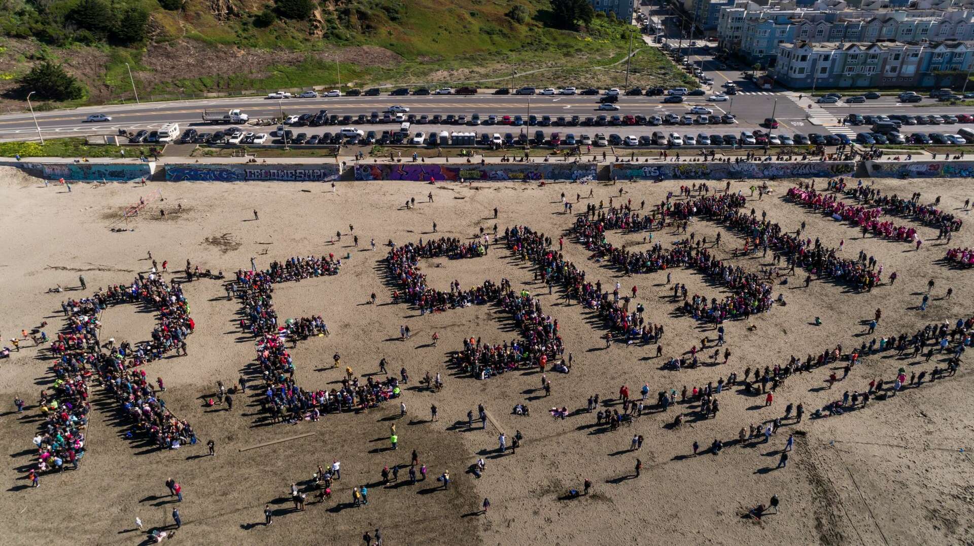 Thousands of protesters spell out 'RESIST!!' on San Francisco's Ocean Beach