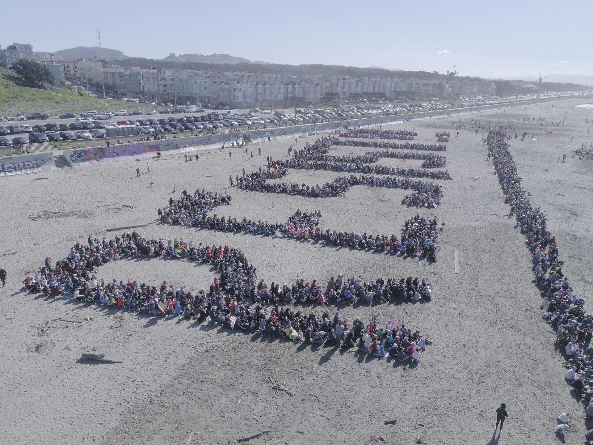 Thousands of protesters spell out 'RESIST!!' on San Francisco's Ocean Beach