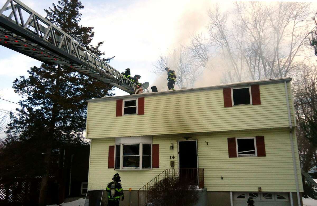 Norwalk firefighters battle house fire