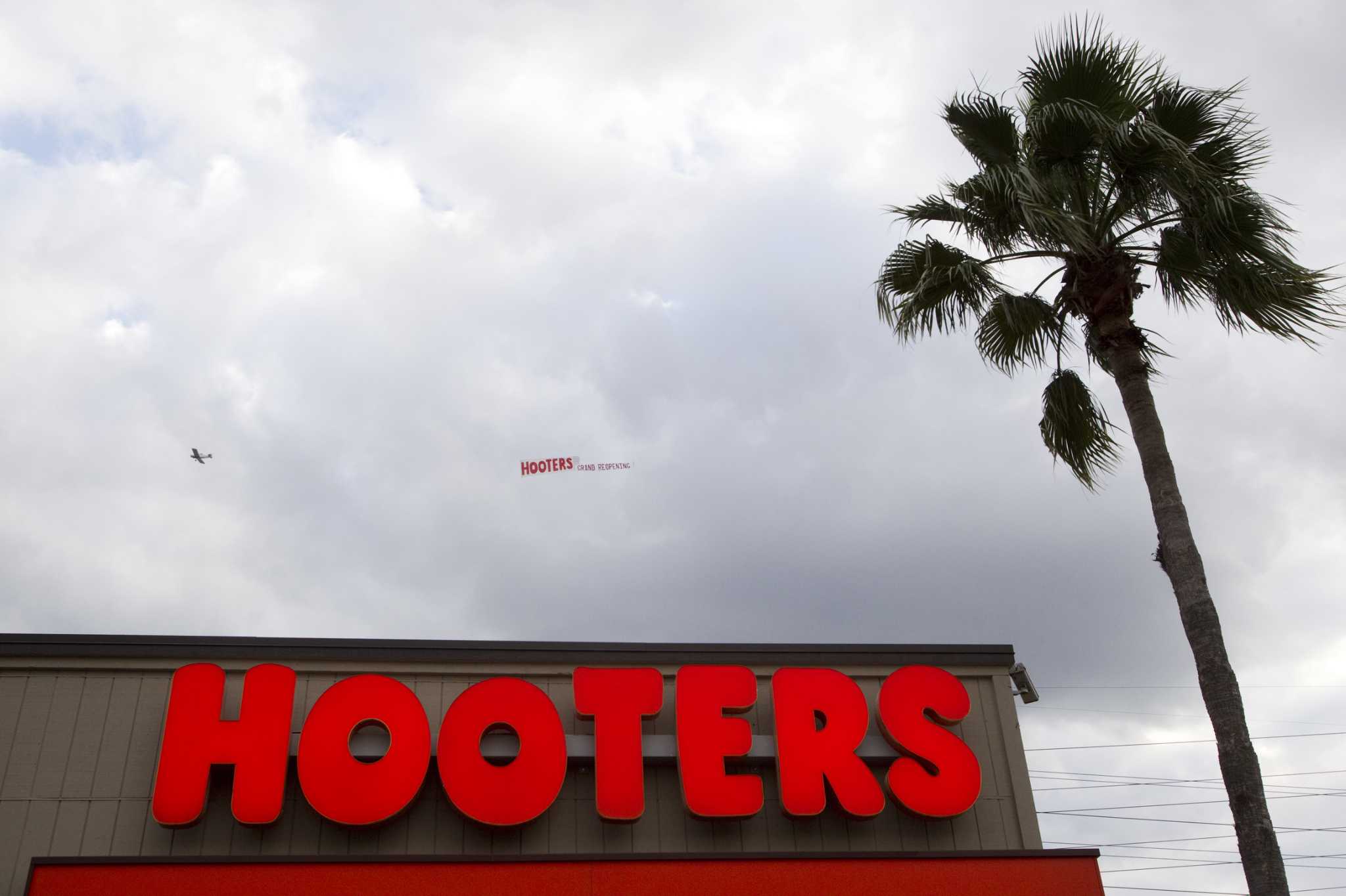 Woman says she was fired after complaining about proposed Hooters ...