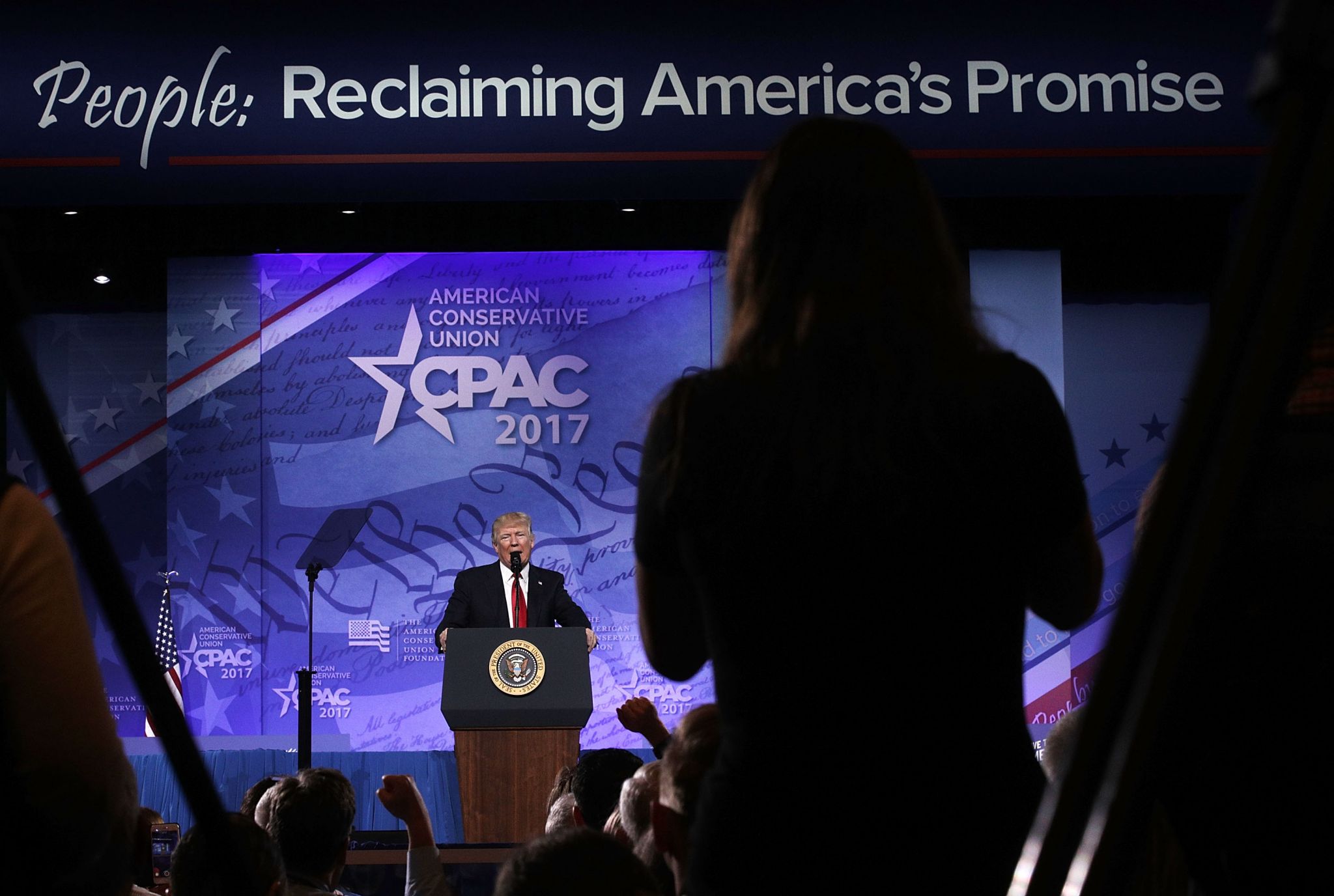 CPAC crowd waves tiny Trump-branded Russian flags before they are ...
