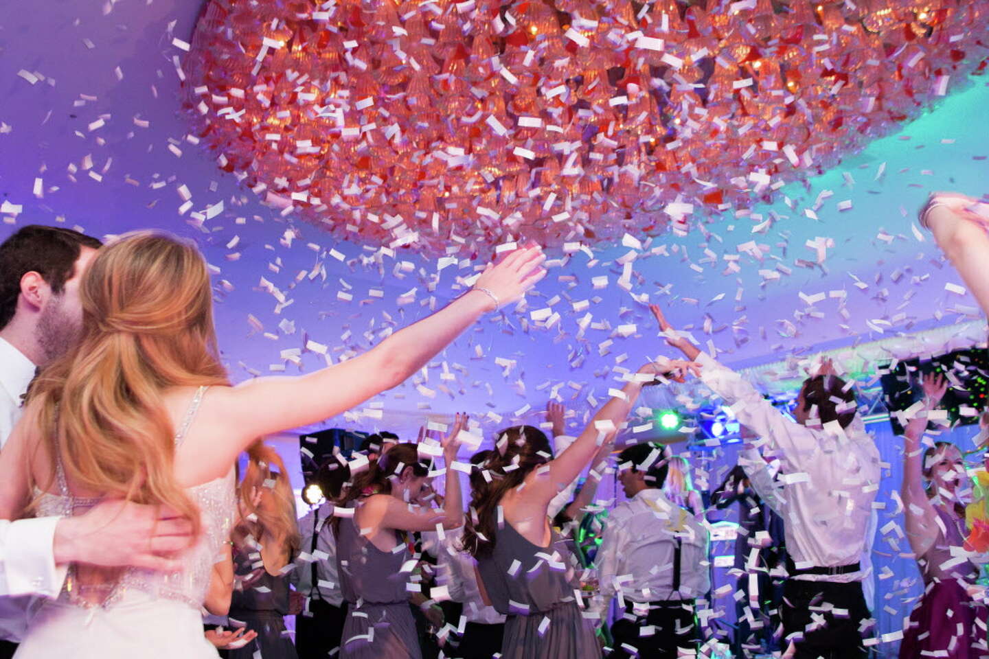 Family friends tie the knot at Four Seasons, one floor above bride's office