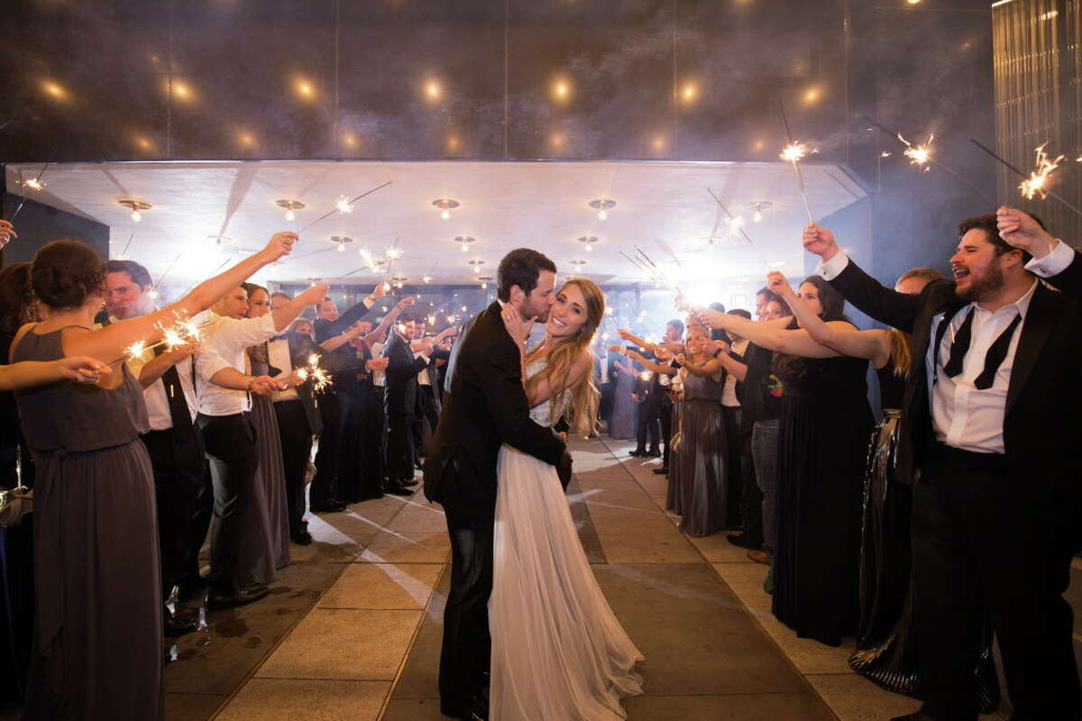 Family friends tie the knot at Four Seasons, one floor above bride's office