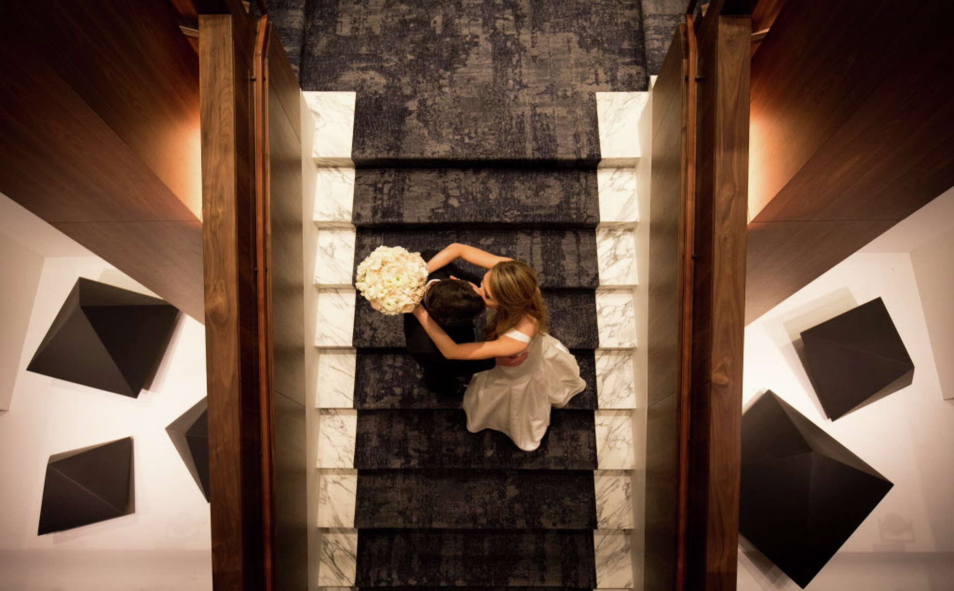 Family friends tie the knot at Four Seasons, one floor above bride's office