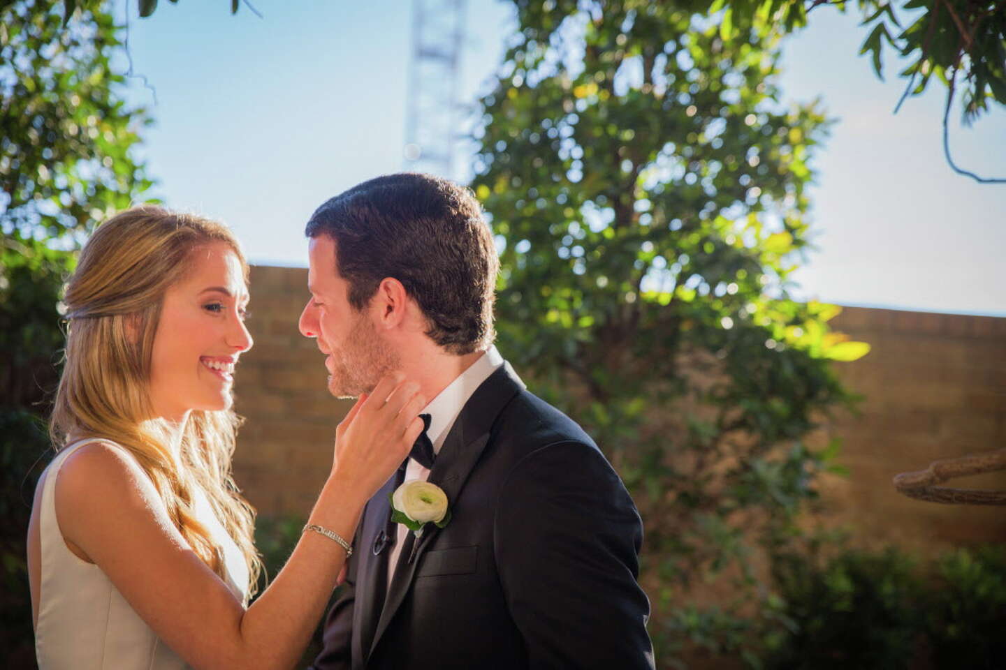 Family friends tie the knot at Four Seasons, one floor above bride's office