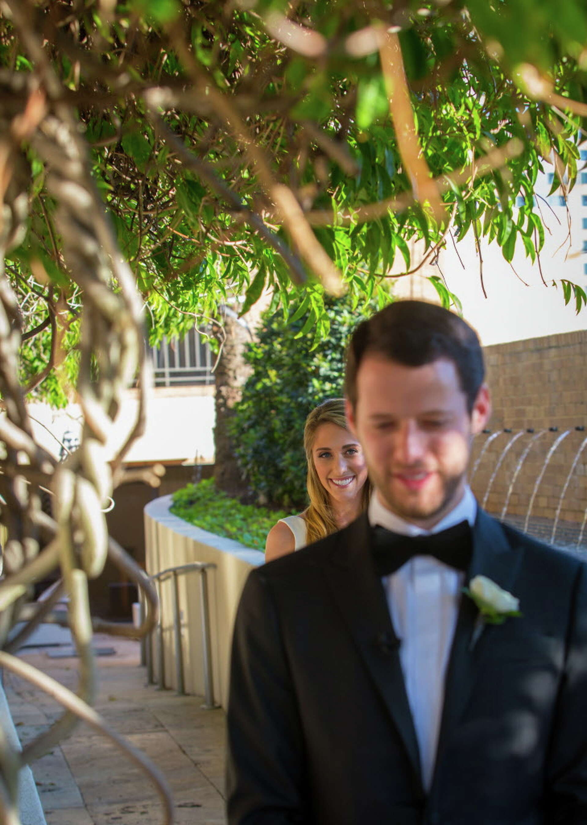 Family friends tie the knot at Four Seasons, one floor above bride's office