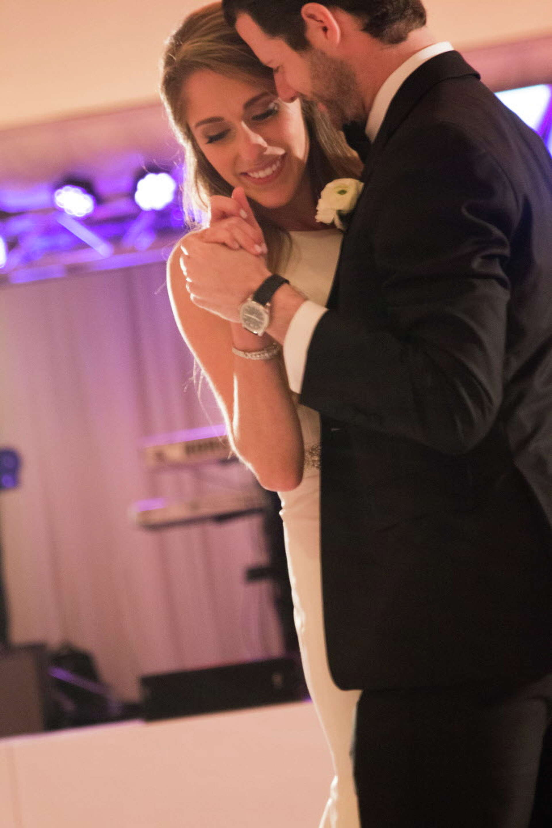 Family friends tie the knot at Four Seasons, one floor above bride's office