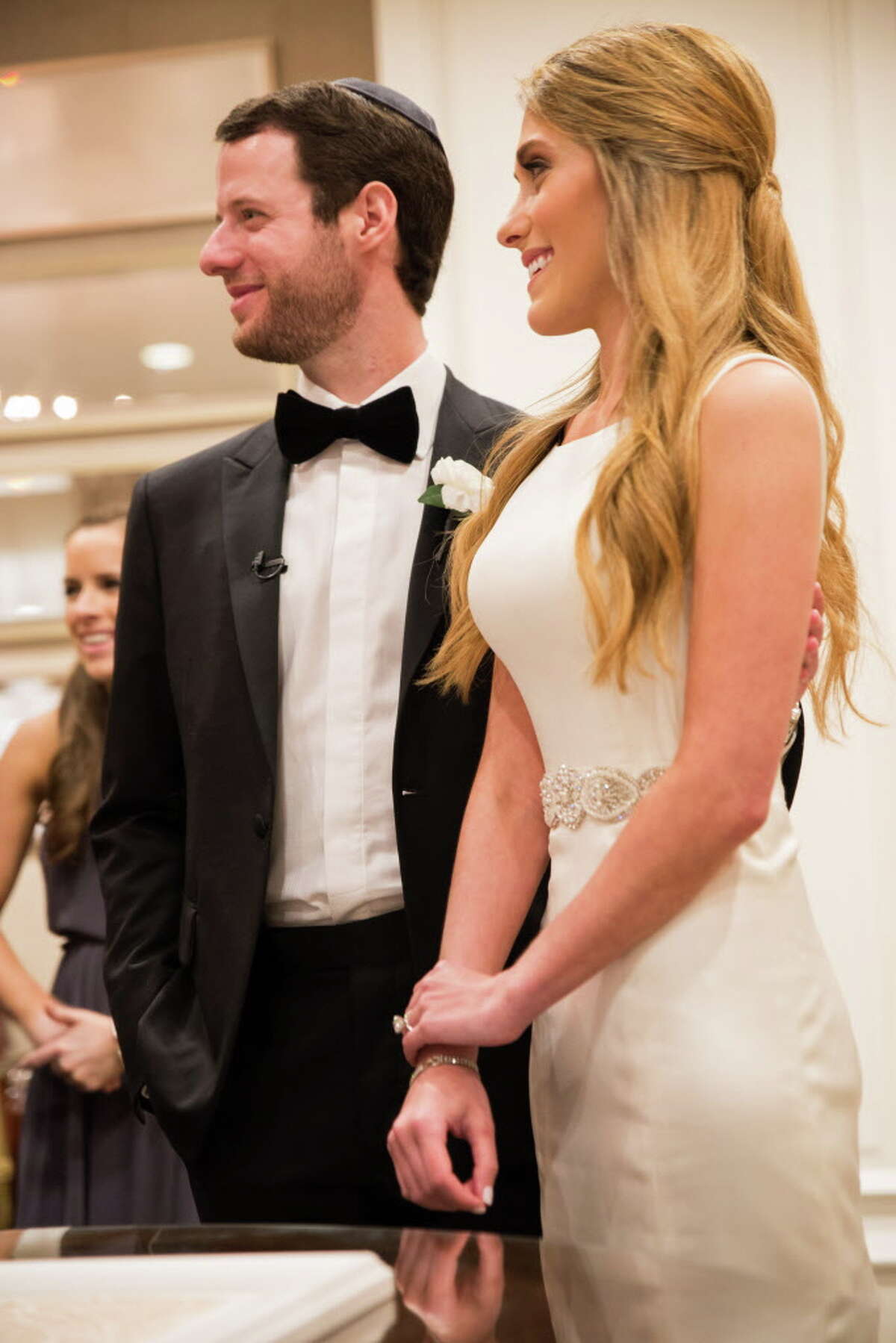 Family friends tie the knot at Four Seasons, one floor above bride's office