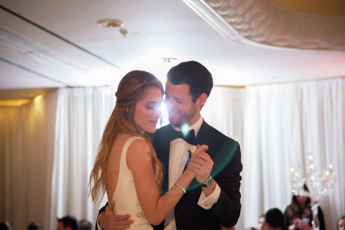 Family friends tie the knot at Four Seasons, one floor above bride's office