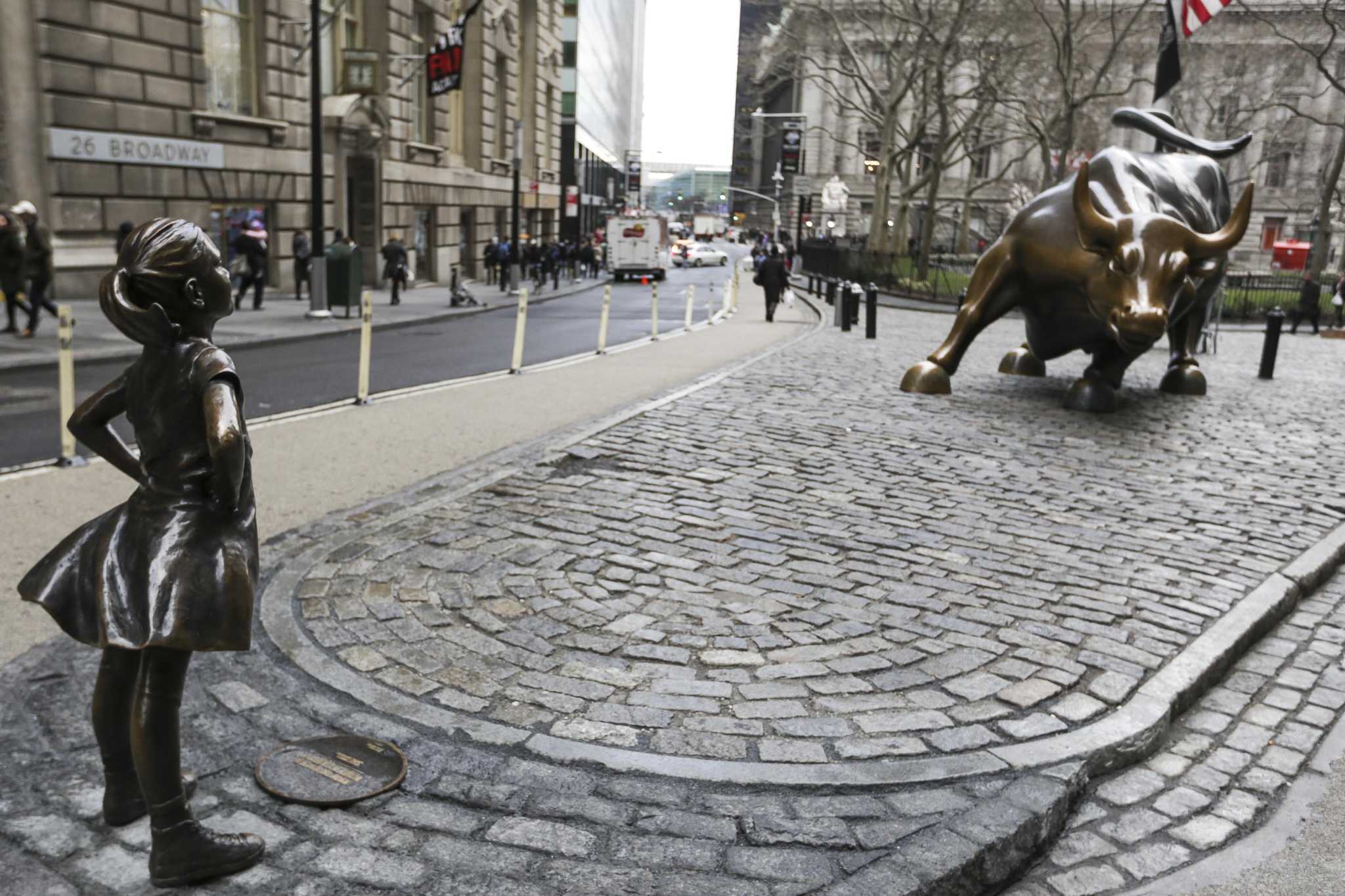 ‘Fearless Girl’ statue stares down Wall Street’s iconic bull