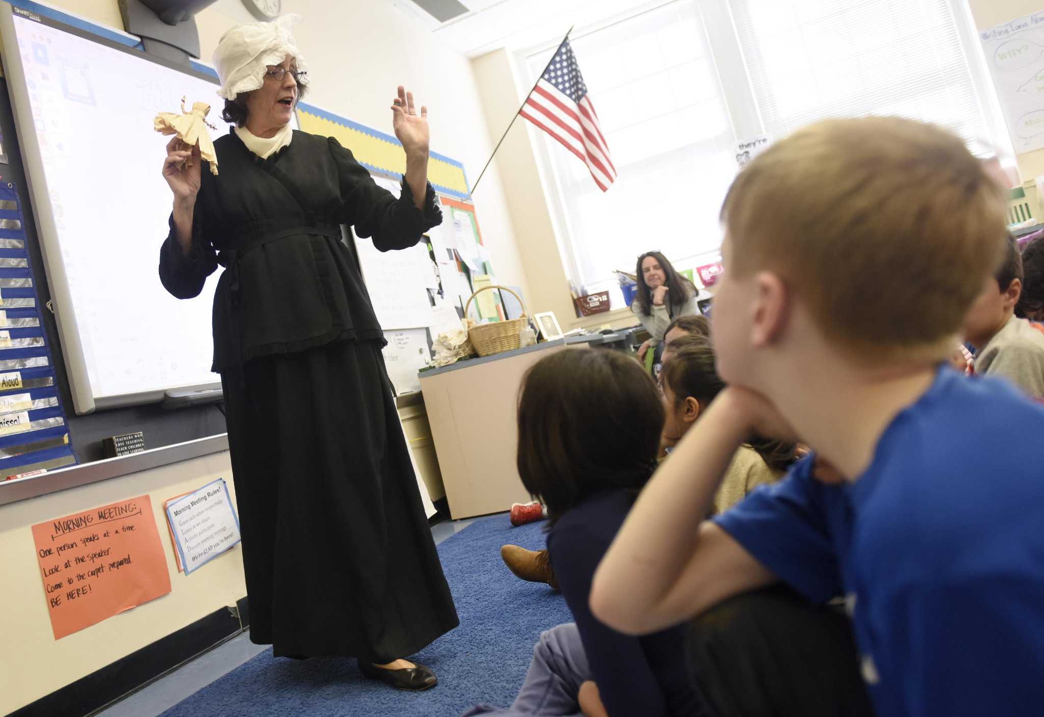Historical figure Sarah Bush visits Cos Cob third graders
