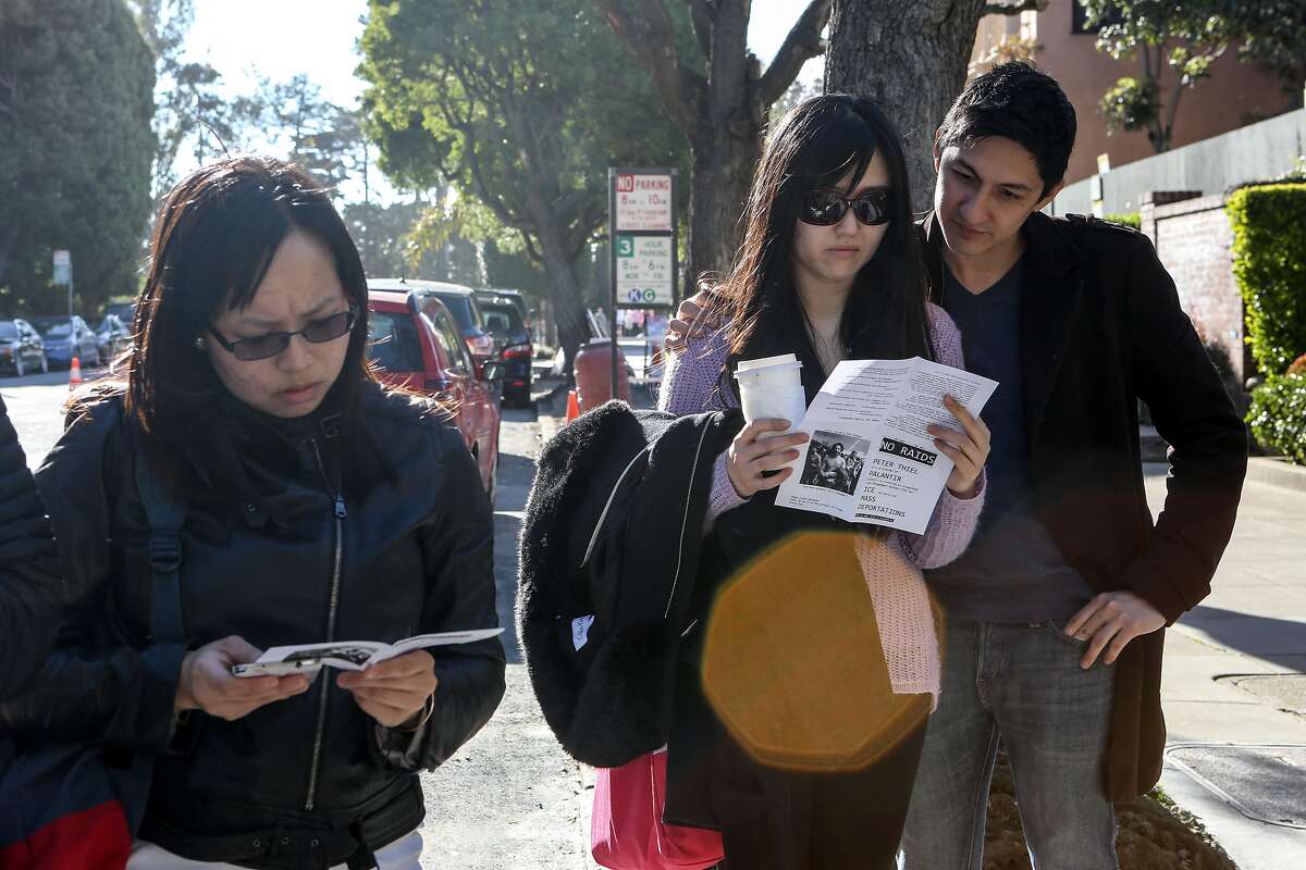 Pro-immigrant demonstrators rally outside Peter Thiel’s SF home